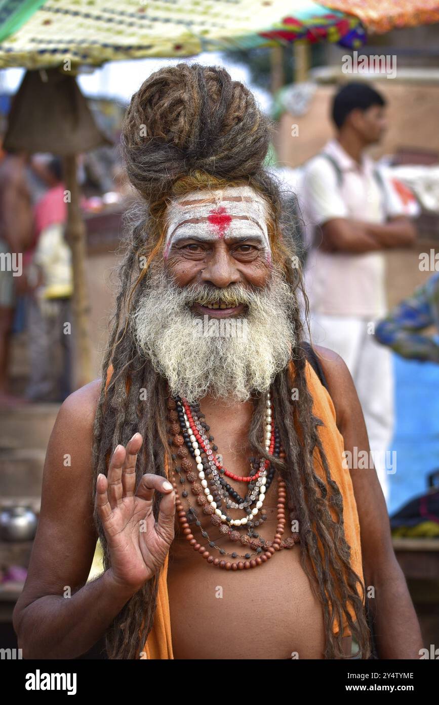 Portrait of a sadhu on ghat by Ganges river, Varanasi, India, Asia ...