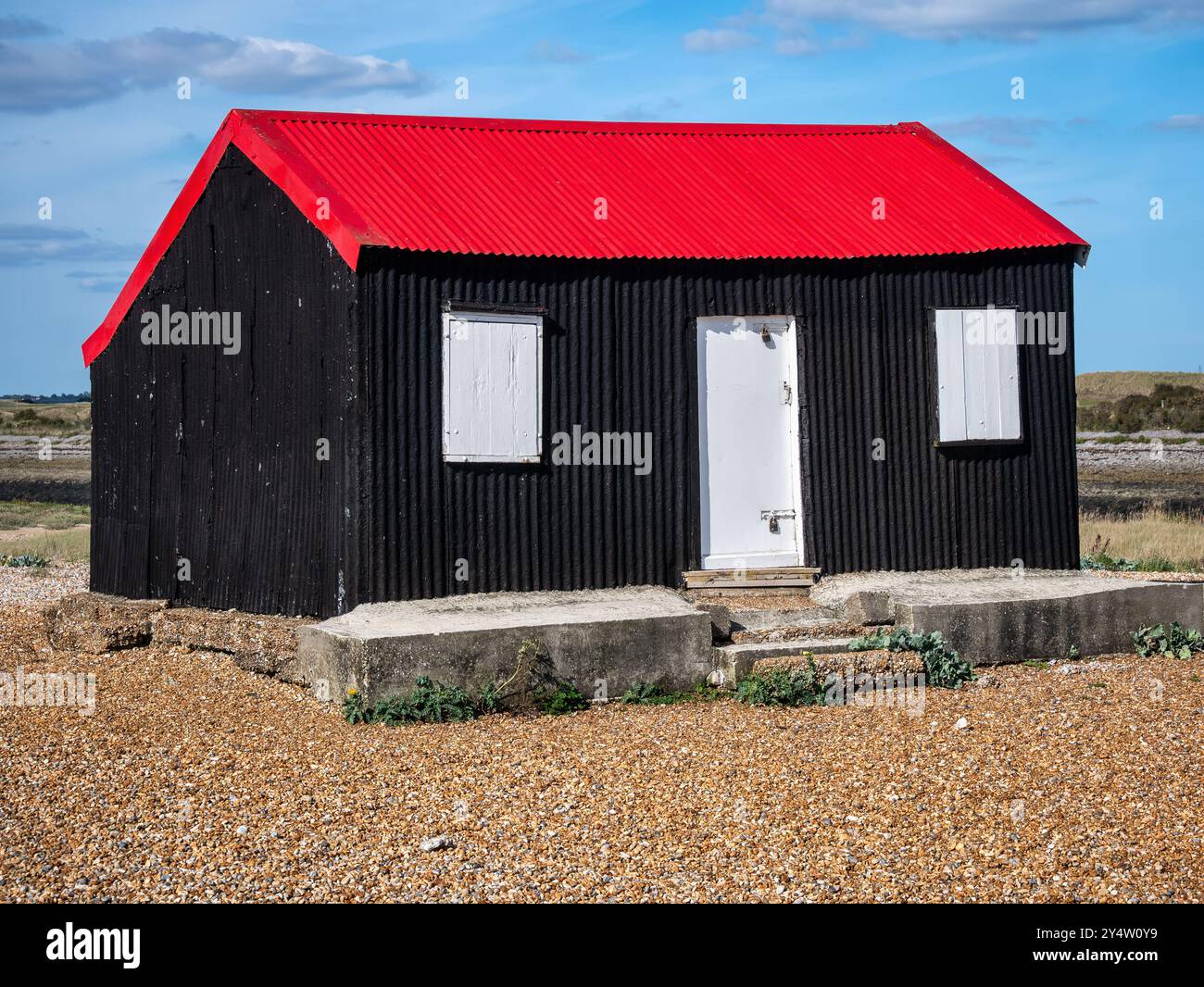 A black hut with a red roof, known as the Fisherman's Hut, is situated ...