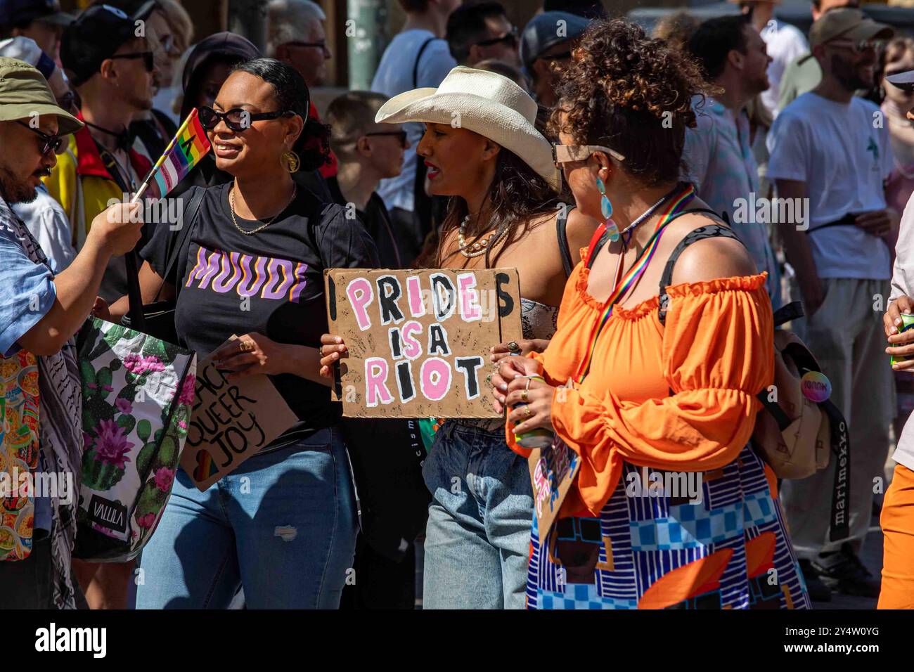 Pride is a riot. Women with handmade sign at Helsinki Pride 2024 parade ...