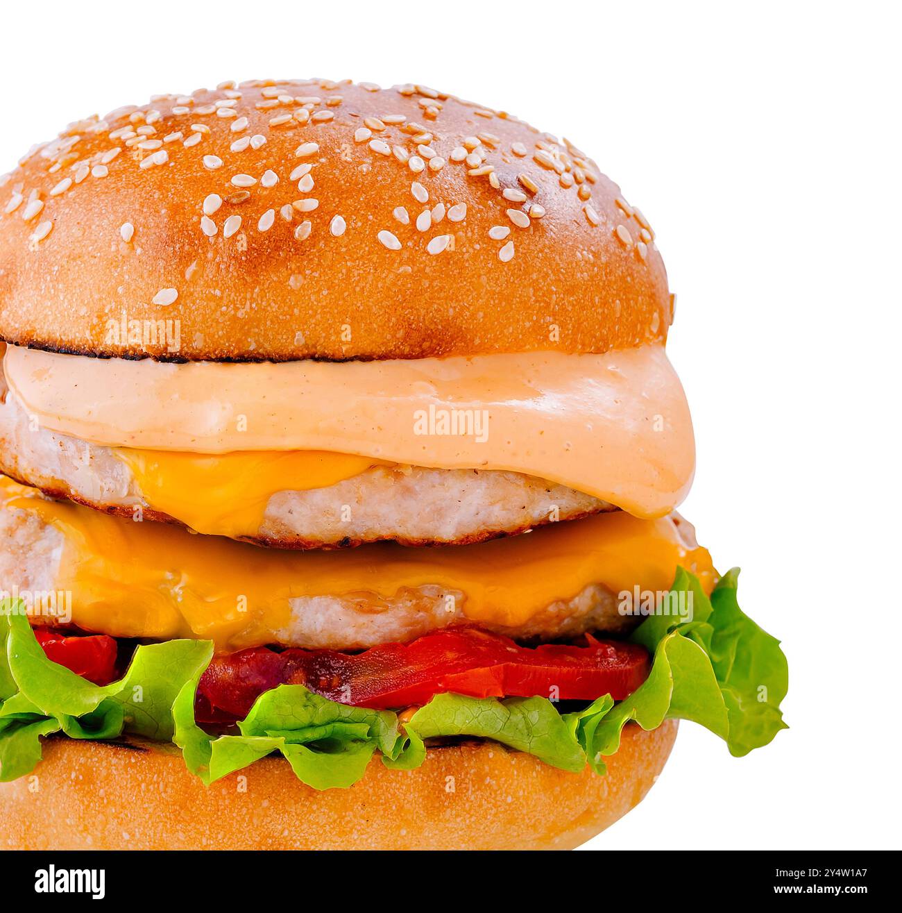 Delicious double burger with crispy patty, melted cheese, fresh vegetables and sauce, isolated ...