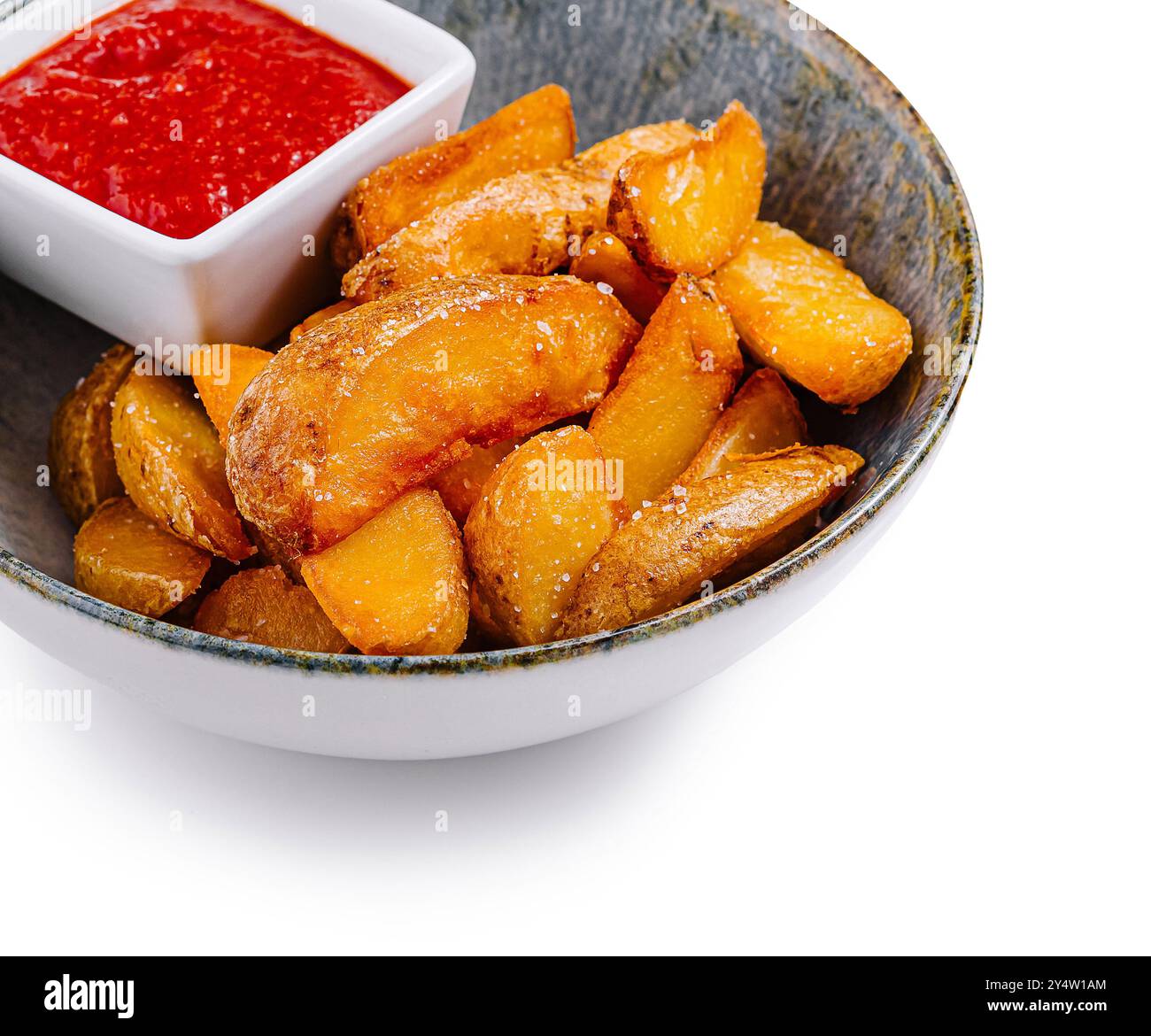 Crispy golden brown potato wedges seasoned to perfection are served ...