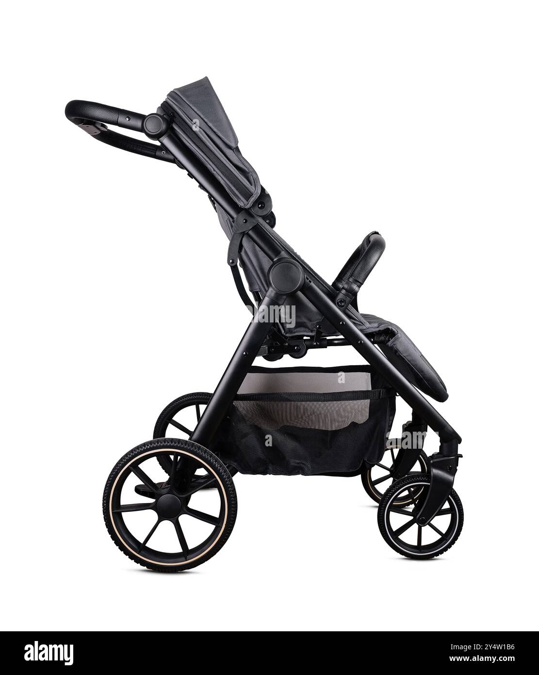 Modern black baby stroller with brown accents is standing on a white ...