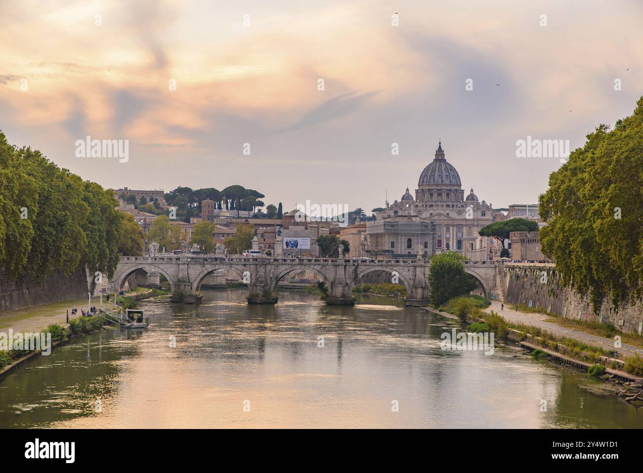 Sunset view of St. Peter's Basilica, Ponte Sant'Angelo, and Tiber River ...