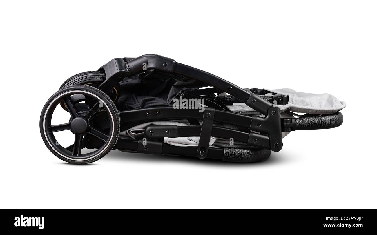 Modern gray and black baby stroller folded and lying on its side ...