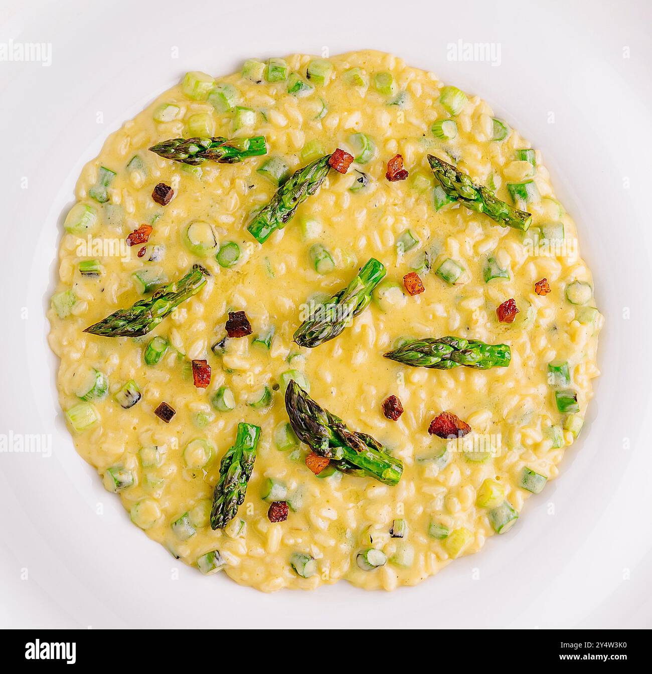 Creamy risotto with asparagus and pancetta, creating a flavorful and ...