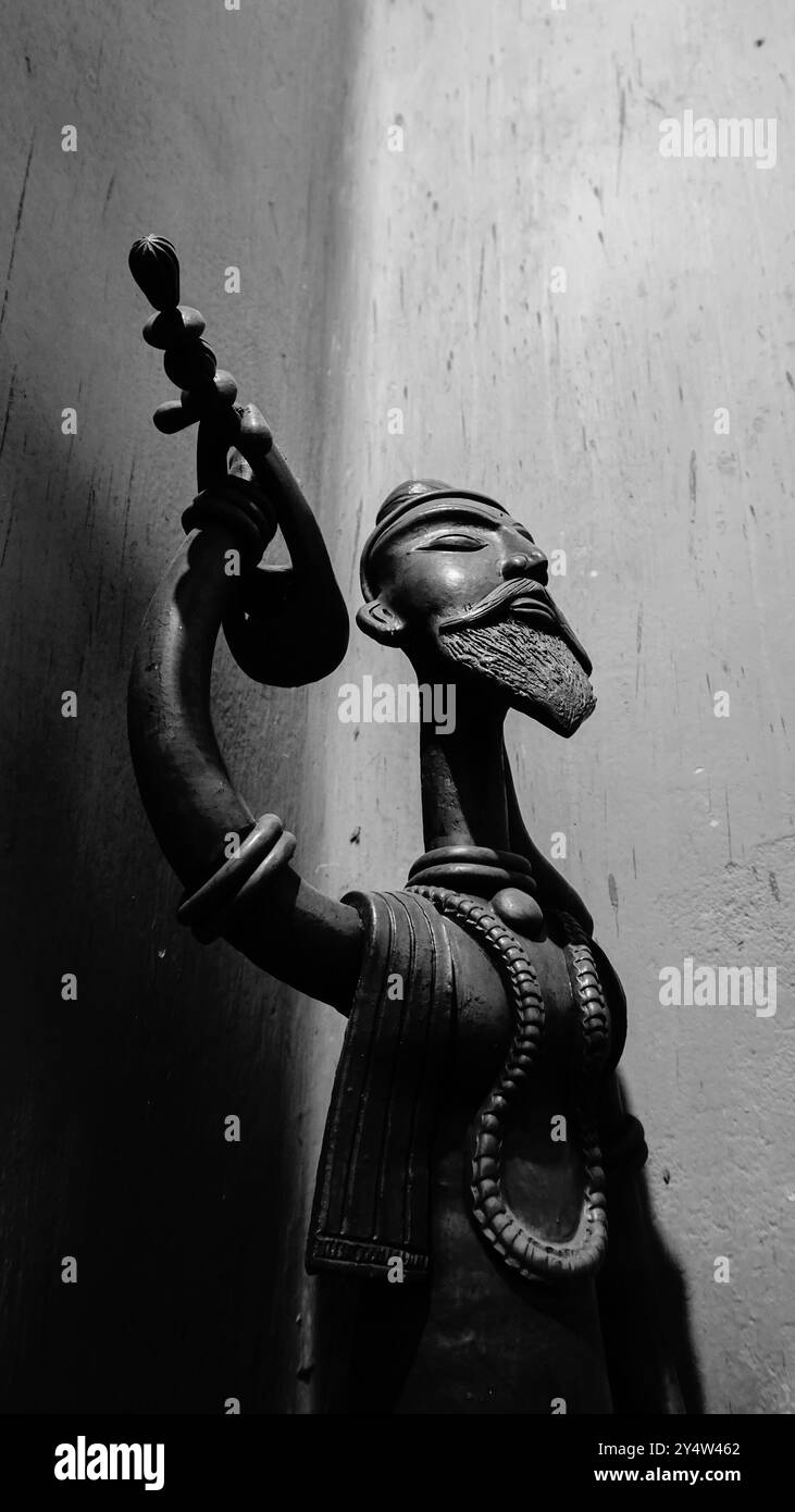 Wooden statue of a Baul, group of Vaishnava Hindus and Sufi Muslims ...