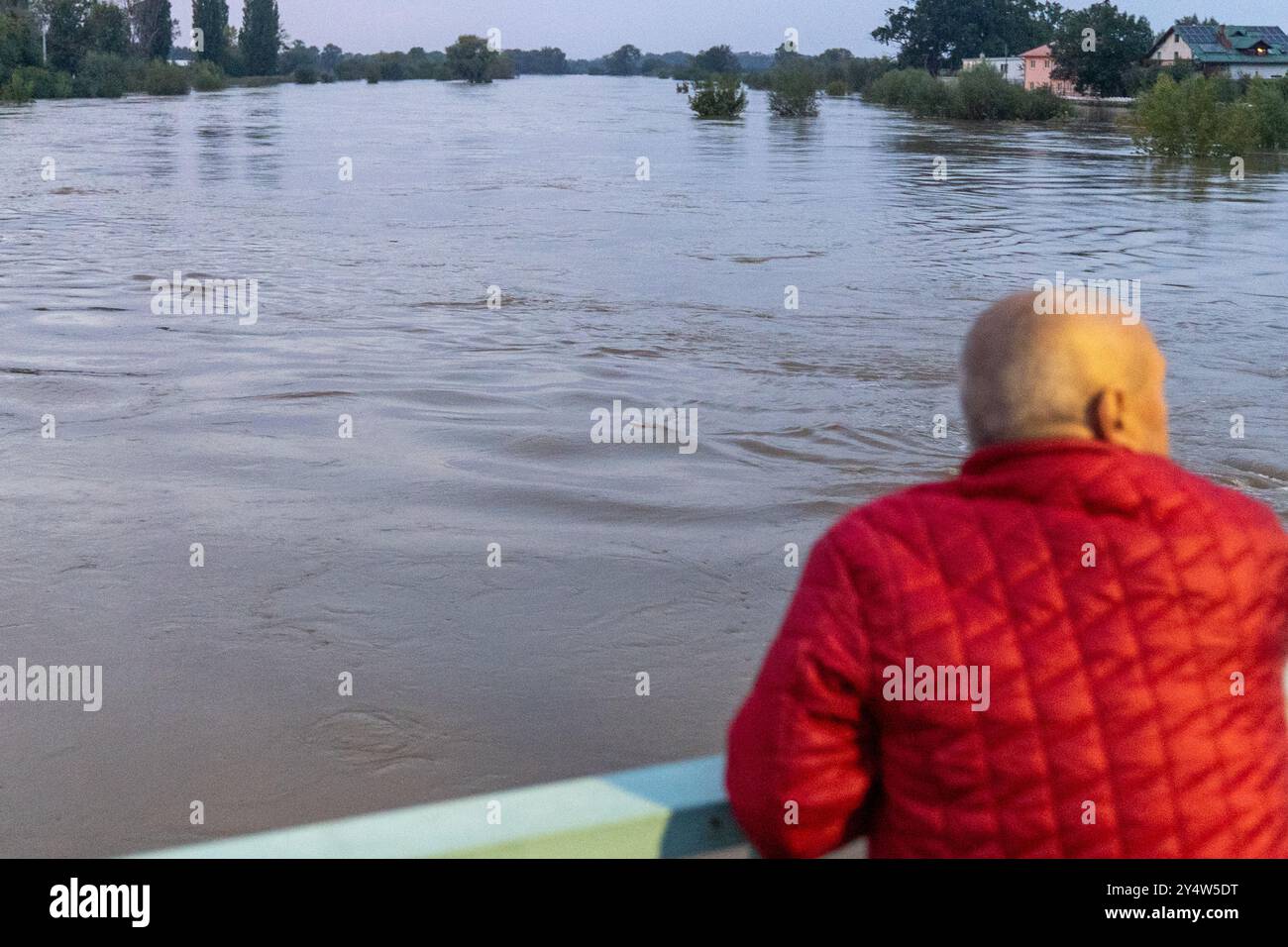 Olawa, Poland. 18th Sep, 2024. A man is observing the river that has ...