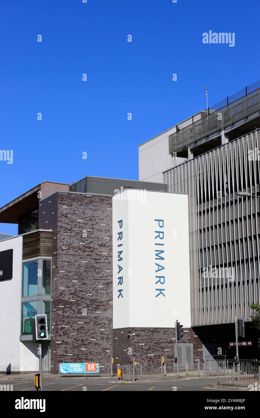 Primark logo next to Multi storey car park with yellow and white car ...