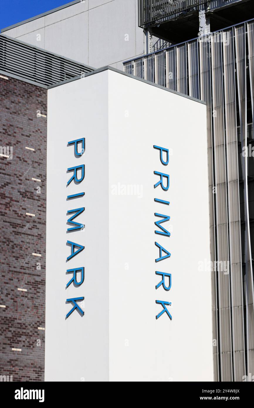 Primark logo next to Multi storey car park with yellow and white car ...