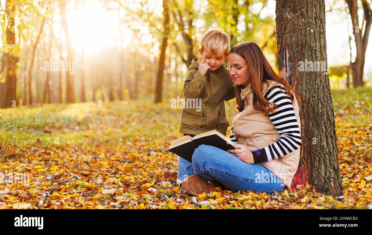 Parent and child reading in woods hi-res stock photography and images ...