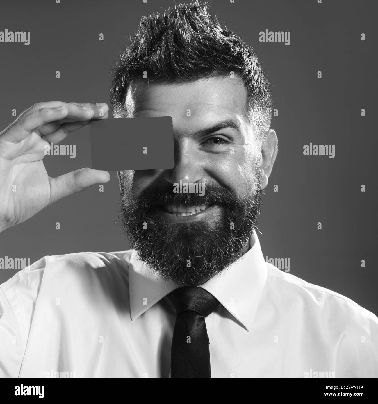 Smiling Bearded Man In Formalwear Covering Eye With Credit Or Debit Bank Card Banking Service