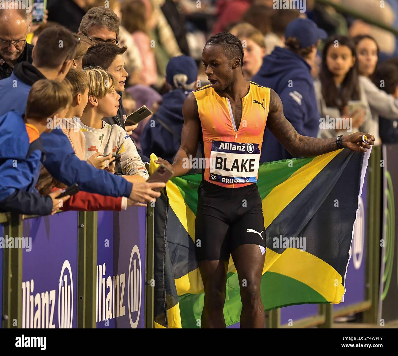 Ackeem Blake of Jamaica celebrates with fans after competing in the men ...