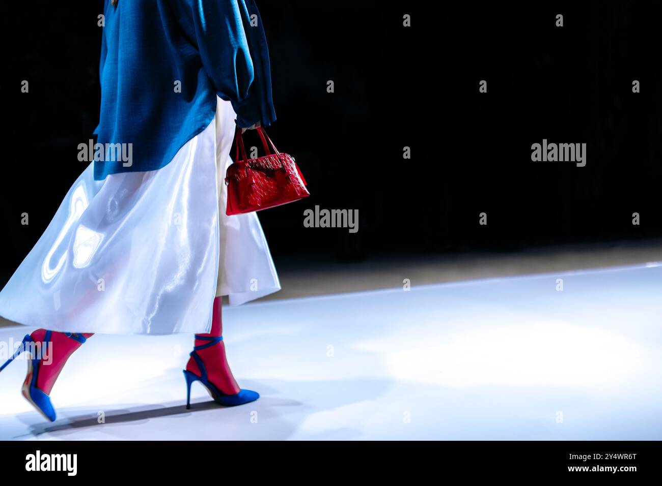 Elegant outfit, white long skirt, high heels and red handbag, fashion ...