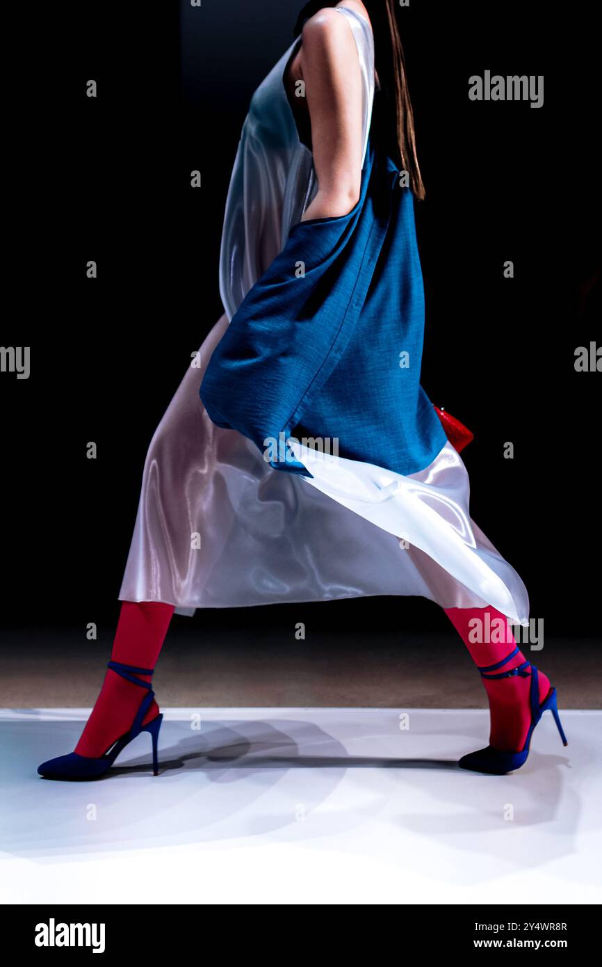 Elegant outfit, white silky long skirt, high heels and blue jacket ...