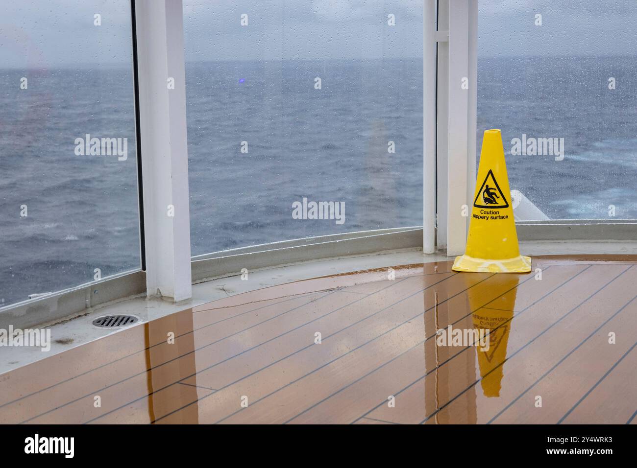 Wet floor sign on deck of cruise ship Stock Photo - Alamy