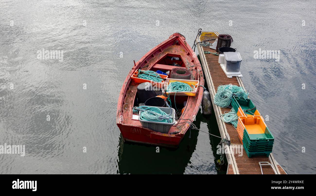small red fishing boat and loaded cargo Stock Photo - Alamy