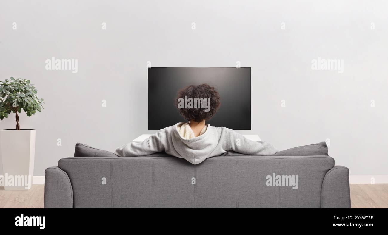 Man watching television back view hi-res stock photography and images ...