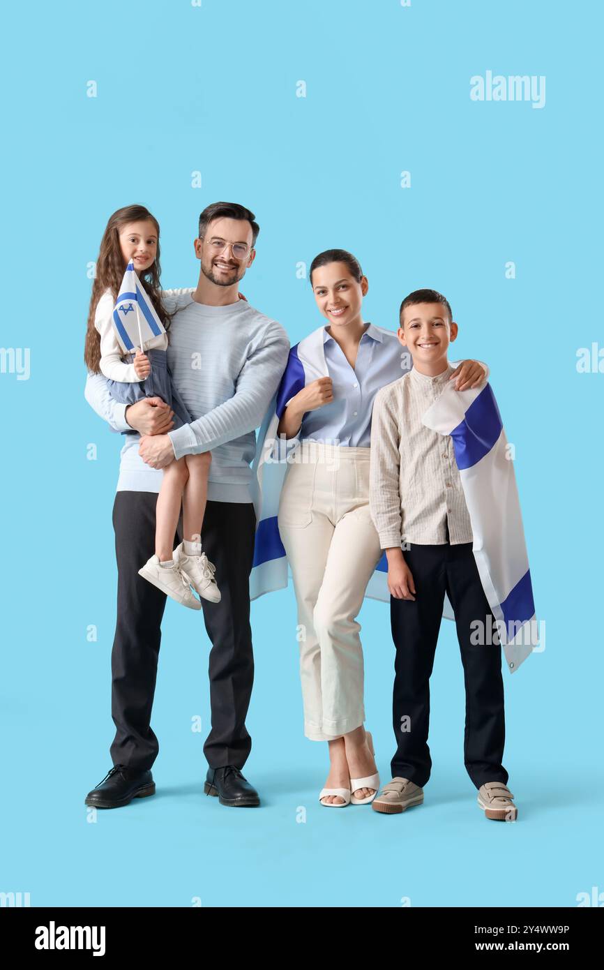 Happy Jewish family with flags of Israel on blue background Stock Photo ...