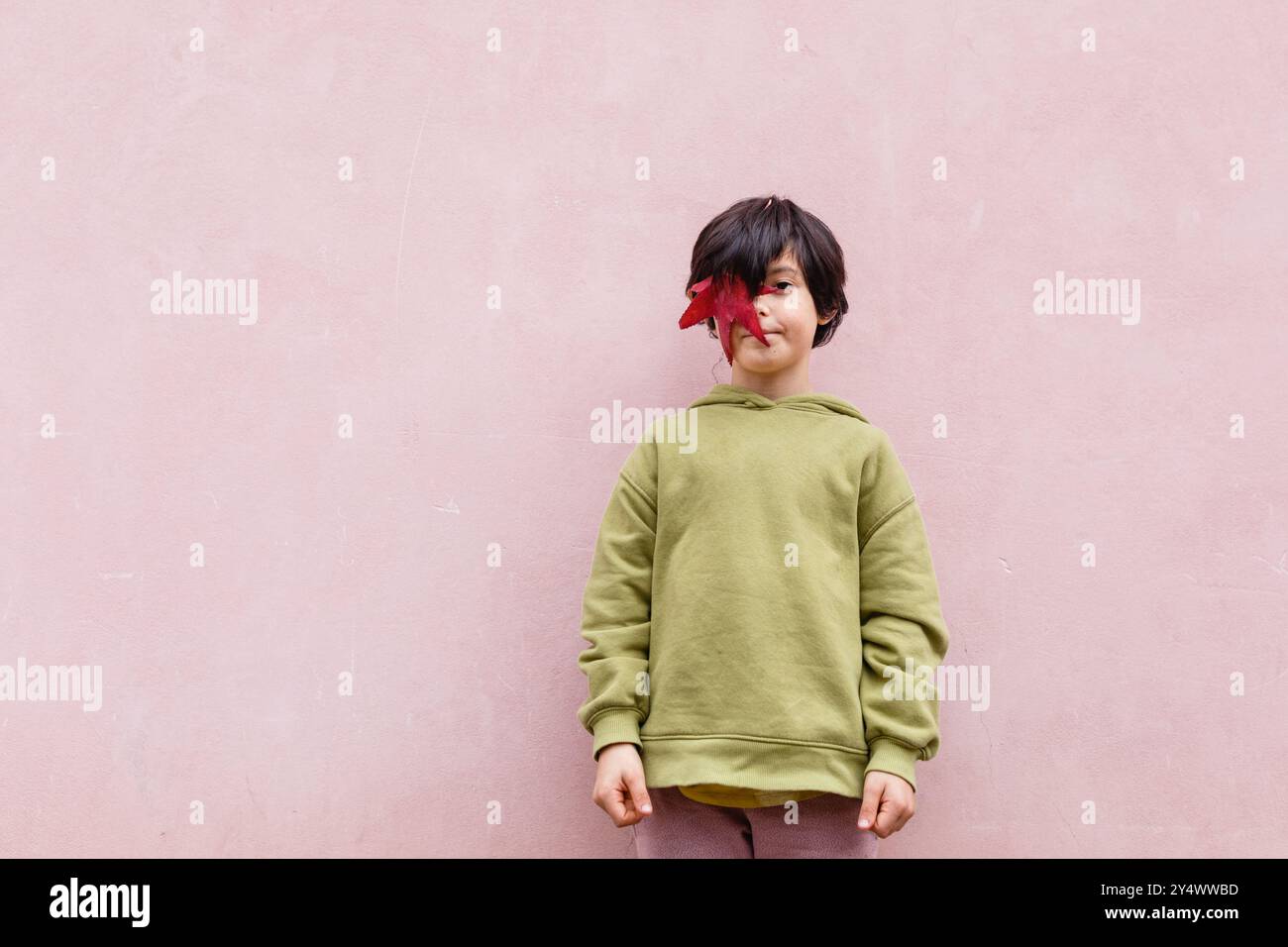Girl hiding behind big leaf hi-res stock photography and images - Alamy