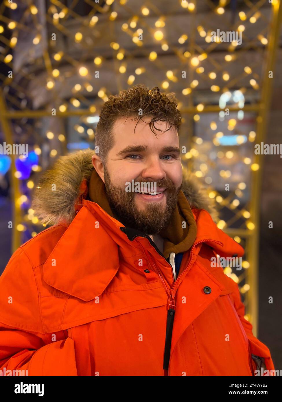 Handsome millennial man model with a hairstyle in winter red jacket ...
