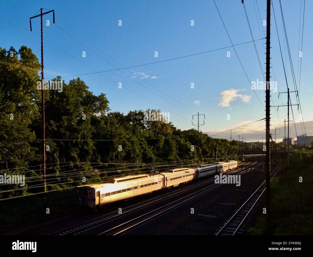 A SEPTA regional rail train heads northeast along tracks through ...