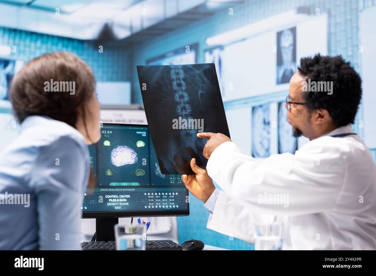 African american physician presenting the x ray diagnostics results to ...