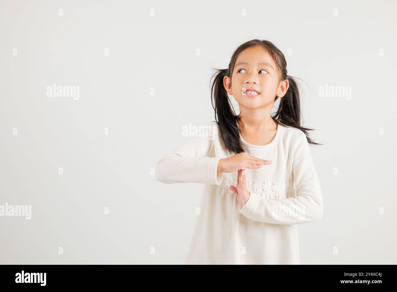 Closeup portrait young kid girl smiling making give time out gesture ...