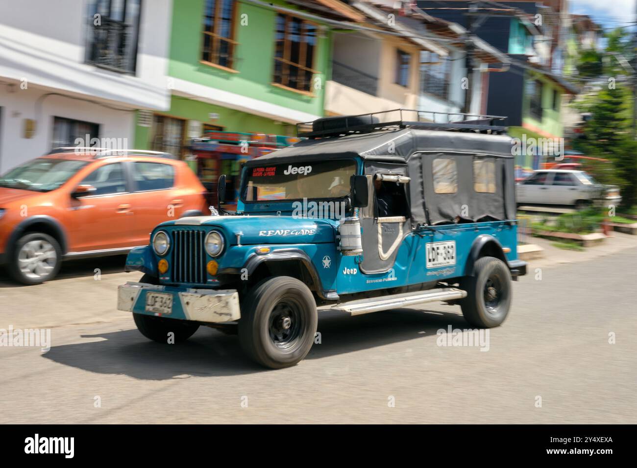 Jeep speeding through Guatapè town , Colombia Stock Photo - Alamy