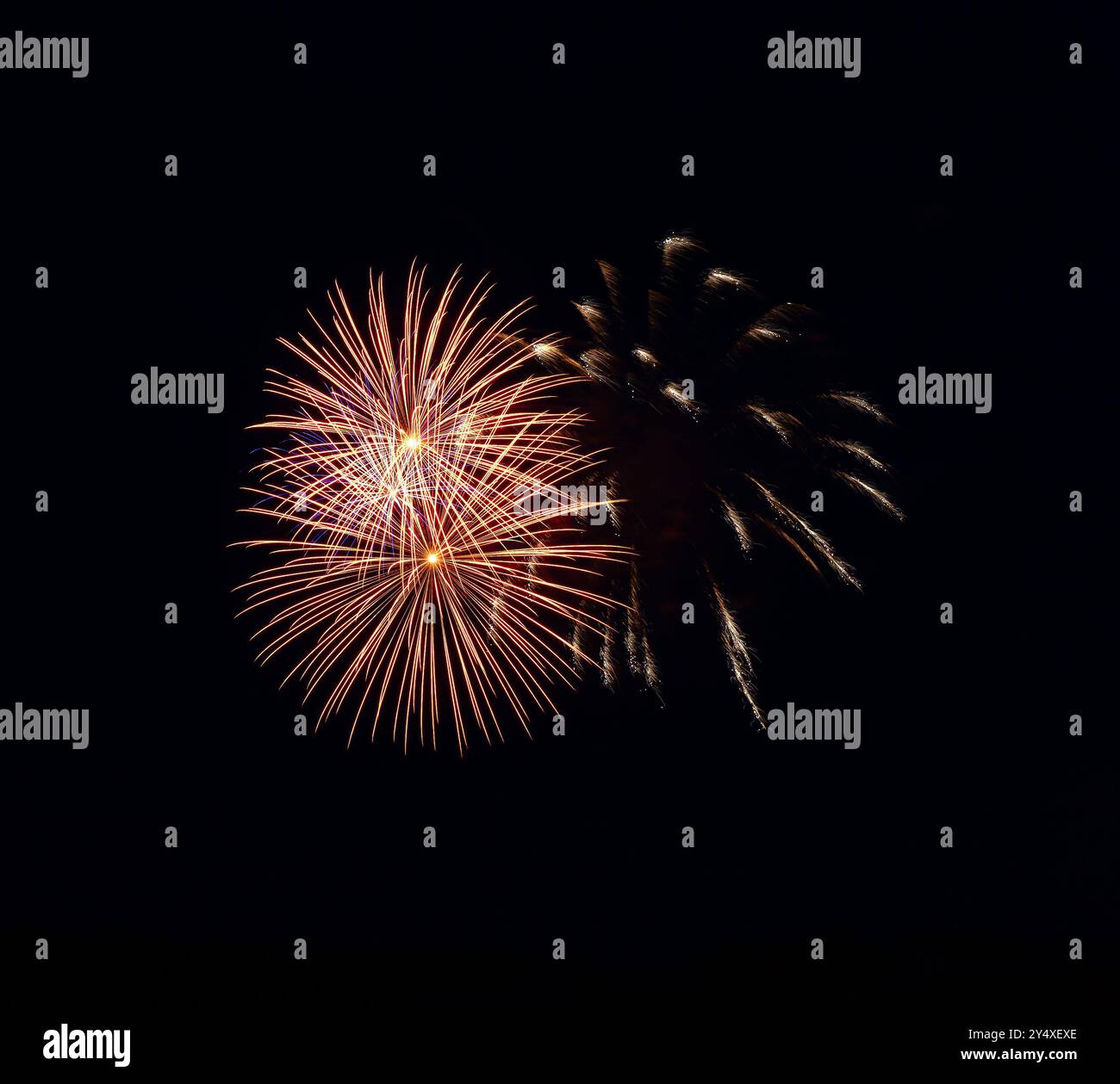 Orange fireworks. Orange starbursts against a black sky Stock Photo - Alamy