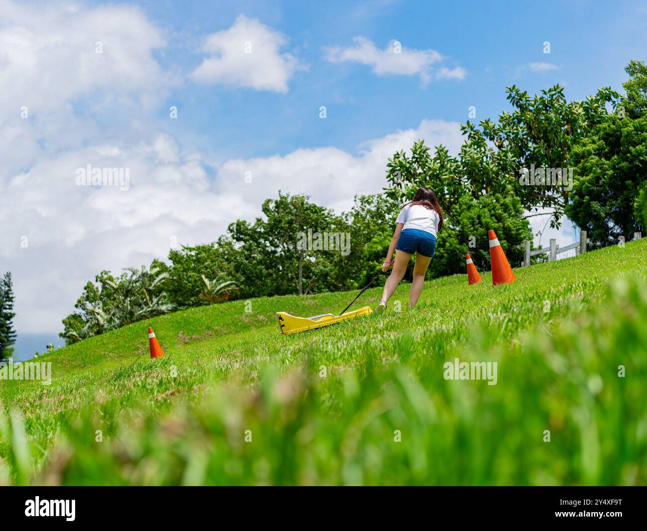 Close up shot of kids playing grass sledding at Taitung, Taiwan Stock ...