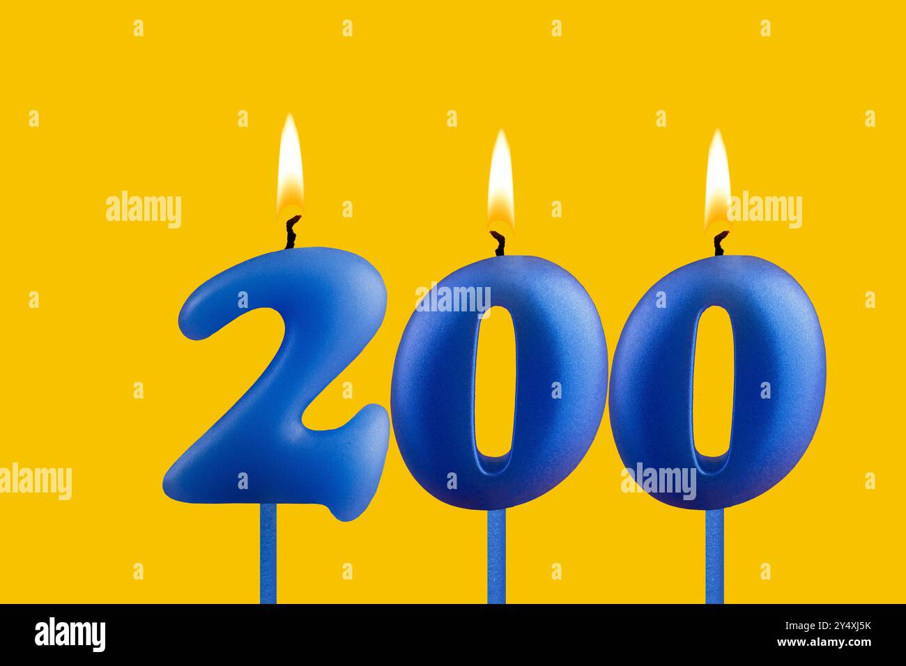 Blue birthday candle on yellow background - Number 200 Stock Photo - Alamy