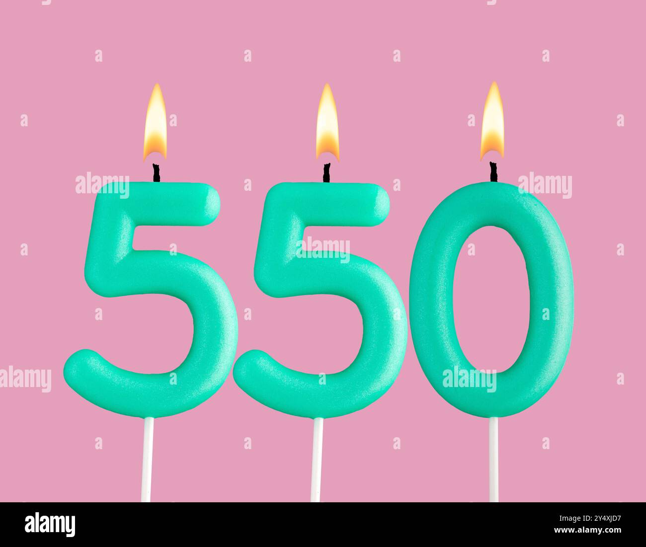 Green candle number 550 - Birthday card on pastel pink background Stock ...