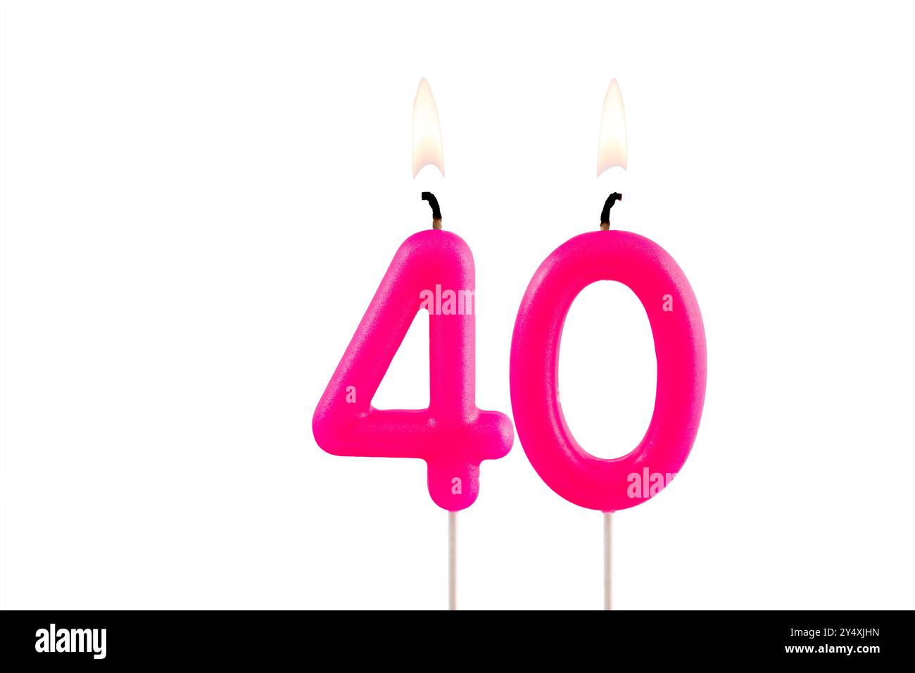 Pink number 40 birthday candle lit on white background Stock Photo - Alamy
