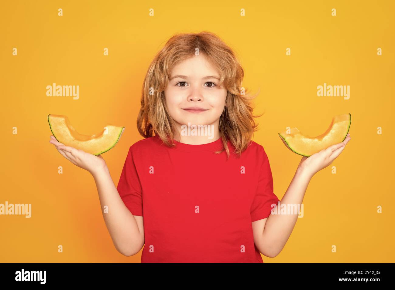 Healthy fruits for kids. Child hold red melon in studio. Melon fruit ...