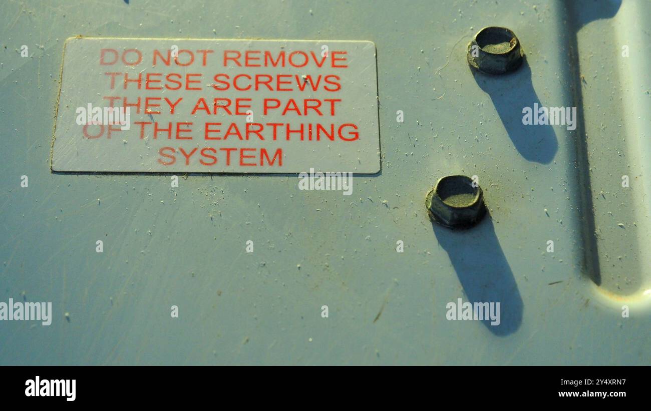 Electrical warning sign on the back of a clothes dryer Stock Photo - Alamy