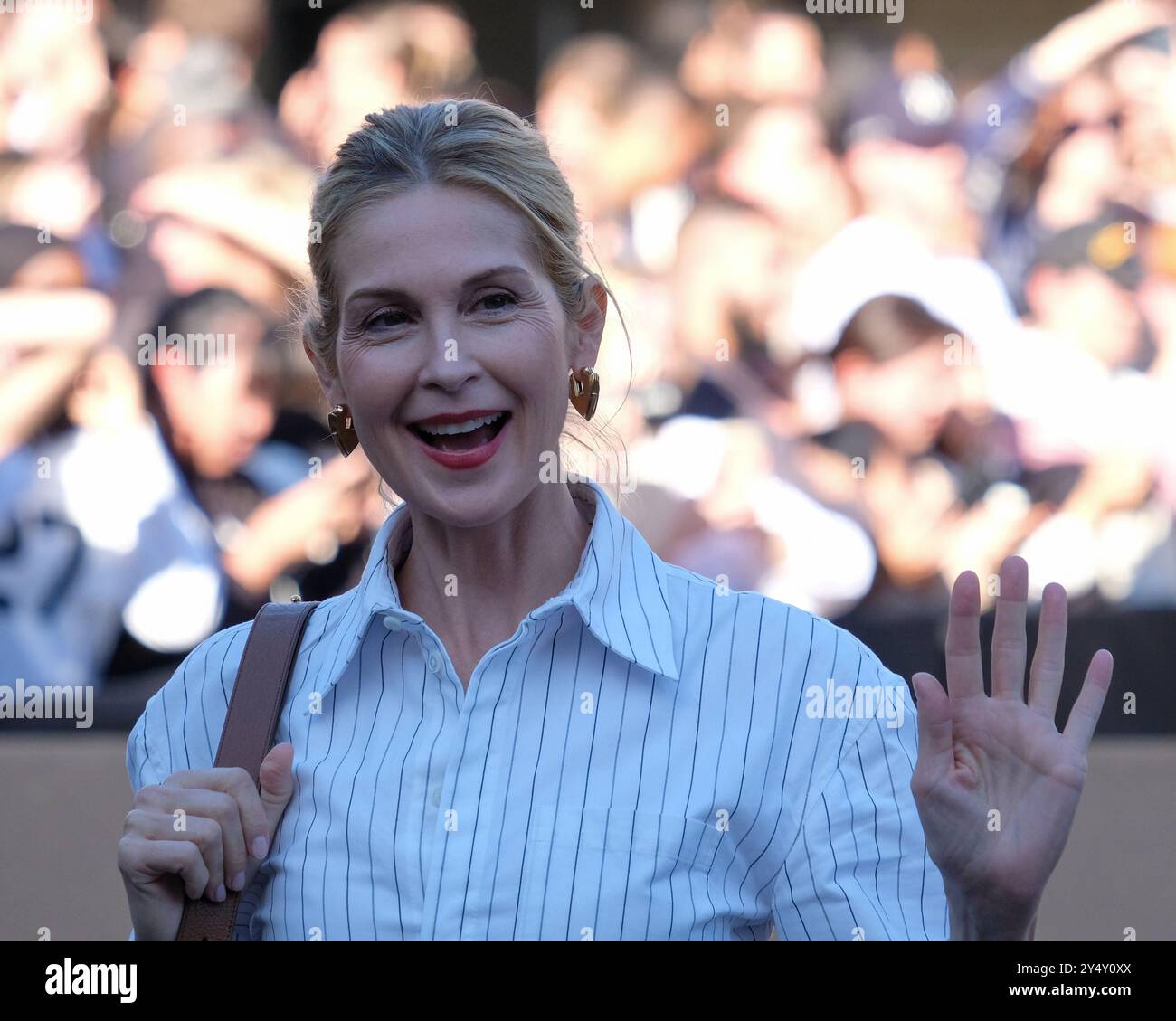 American actress Kelly Rutherford smiles for the camera as she arrives ...
