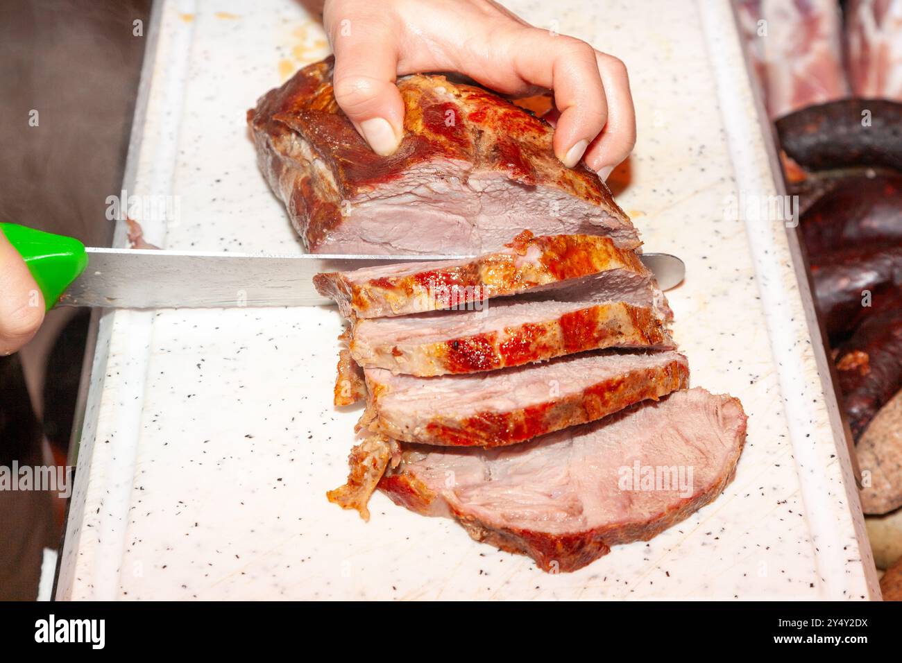 Butcher cutting hot roast hi-res stock photography and images - Alamy