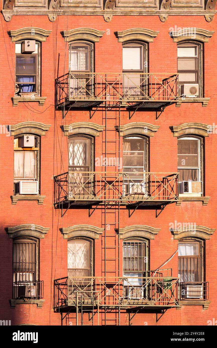 old iron fire escape rescue ladders at old houses in beautiful light ...