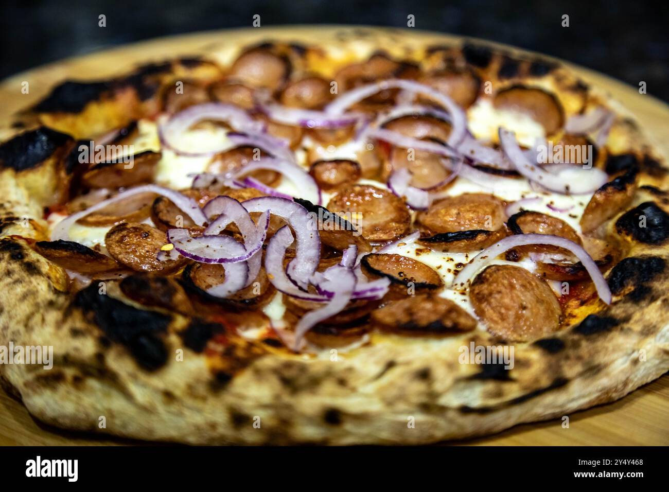 Rustic artisanal pepperoni pizza with red onion Stock Photo - Alamy
