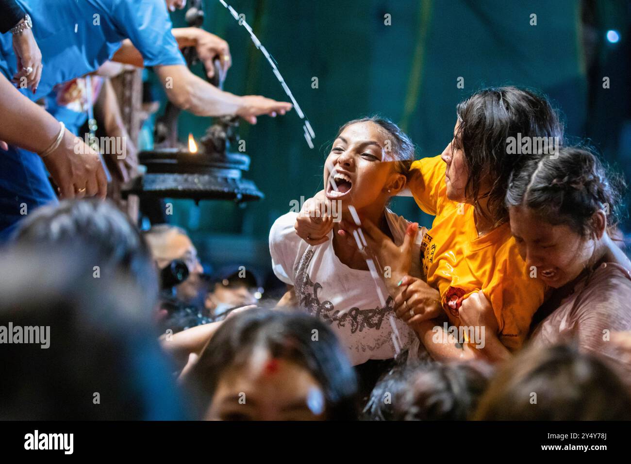 Kathmandu, Nepal. 19th Sep, 2024. Nepalese women struggle to drink ...