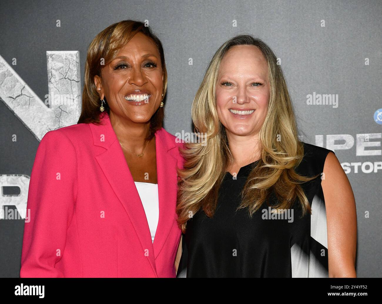 Robin Roberts, left, and wife Amber Laign attend the premiere of "Super ...