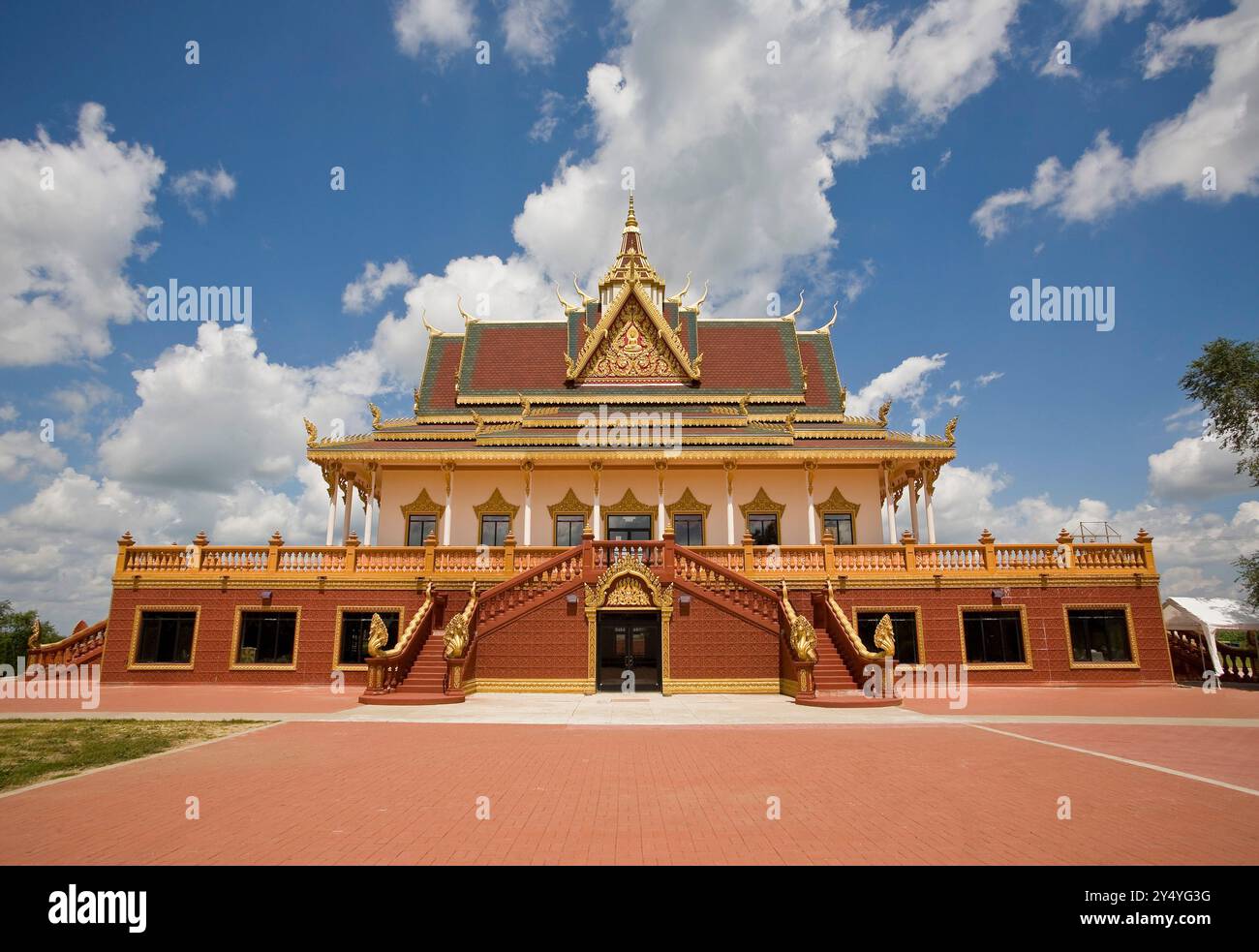 Buddhist temple seen across brick courtyard Stock Photo - Alamy