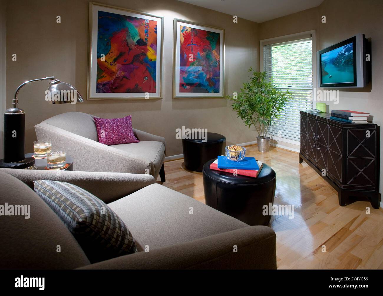 Small Television Room with Colorful Artwork Stock Photo - Alamy