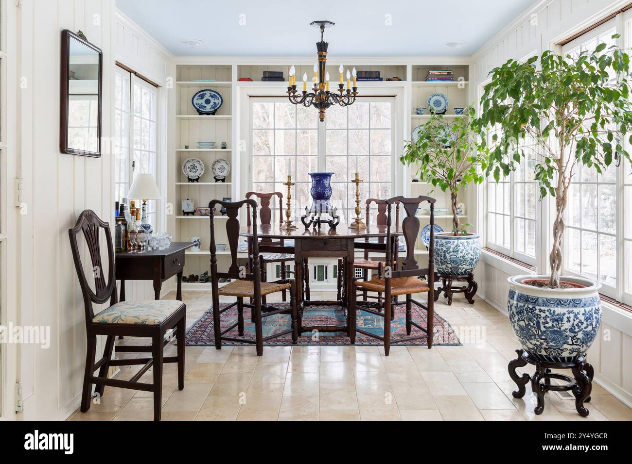 Sunroom with beautiful antique table and chairs and blue and white ...