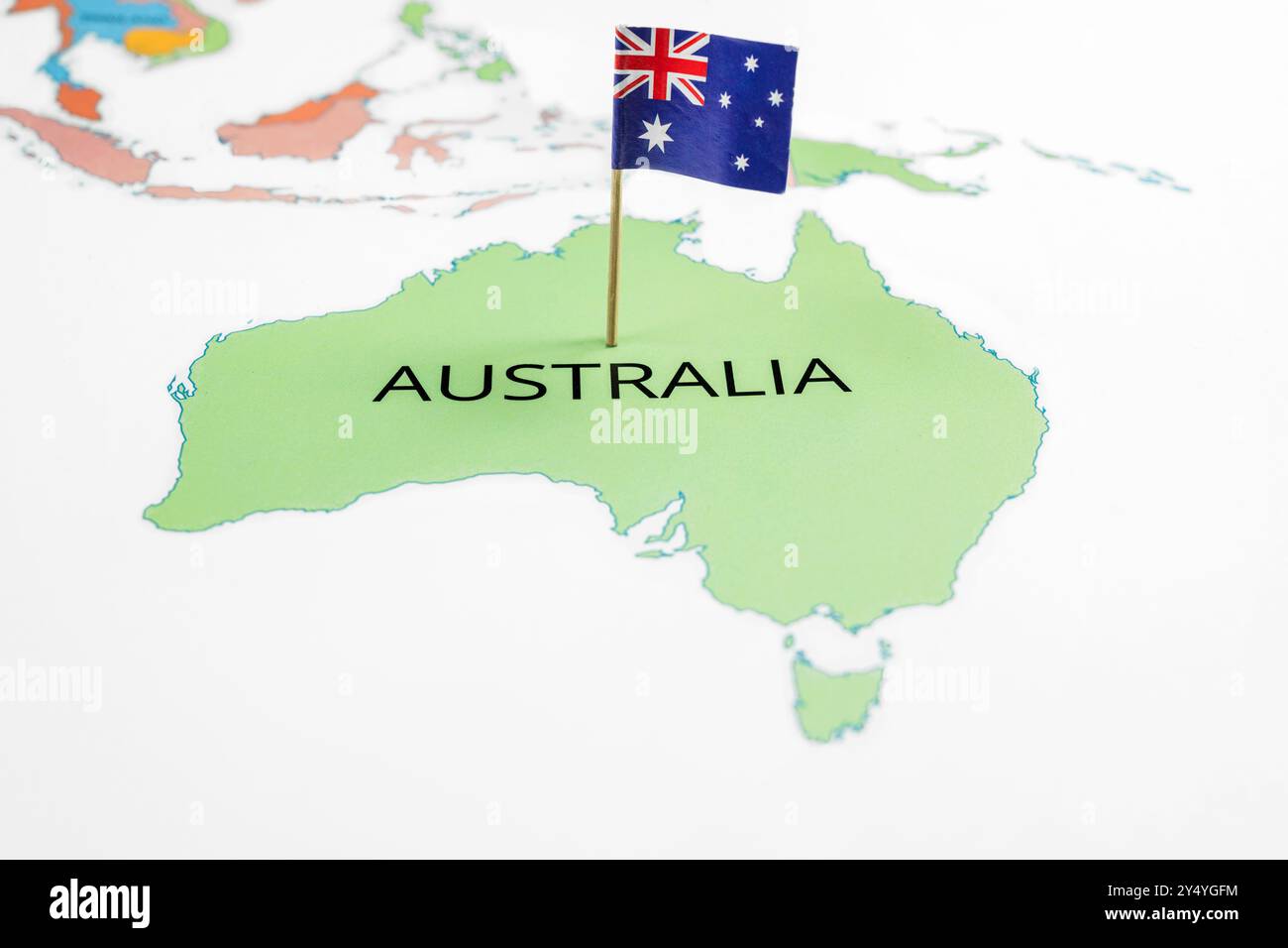 A map of Australia with an Australian flag on it. The flag is blue with ...