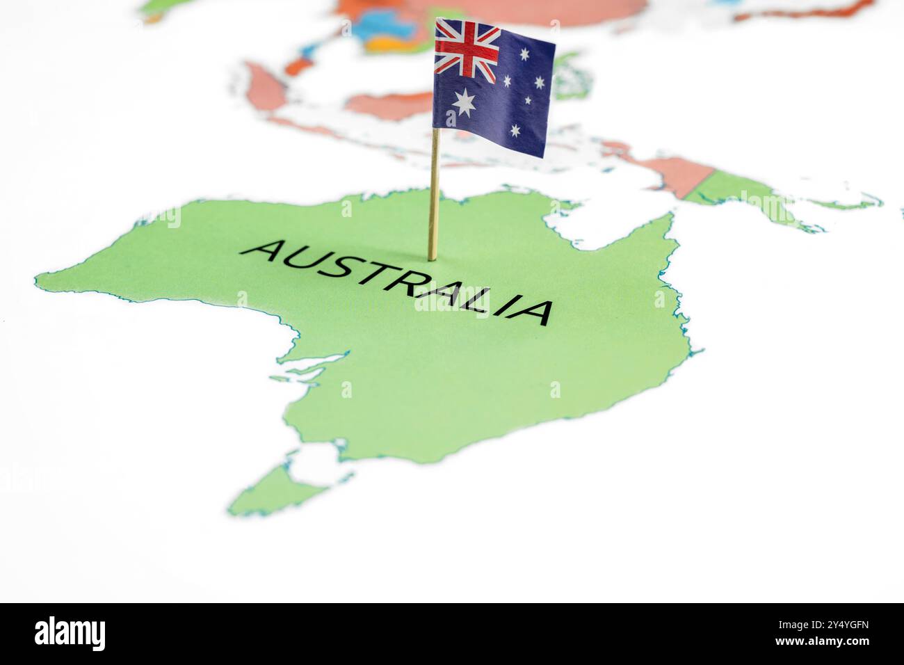 A map of Australia with an Australian flag on it. The flag is blue with ...