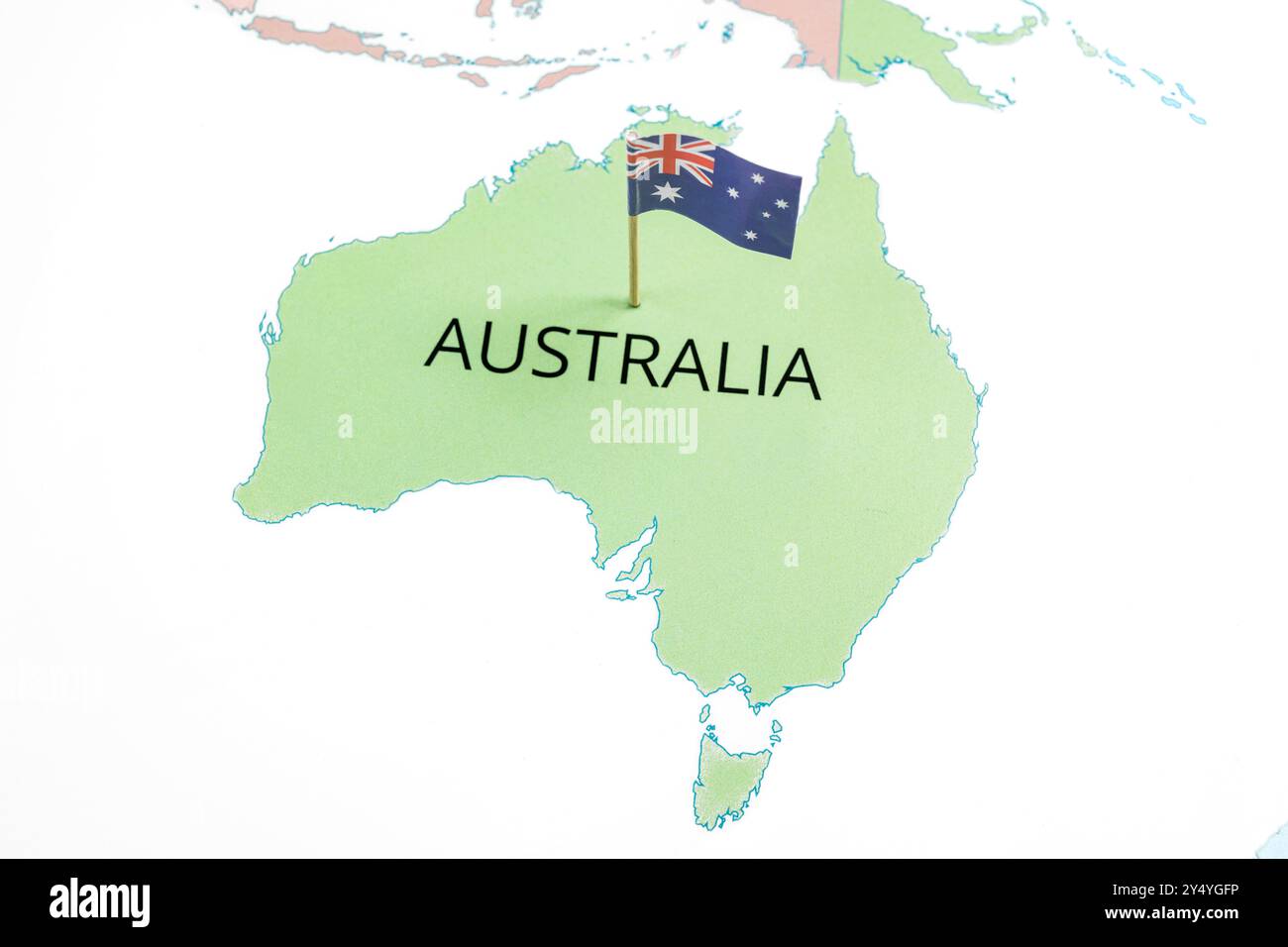 A map of Australia with an Australian flag on it. The flag is blue with ...