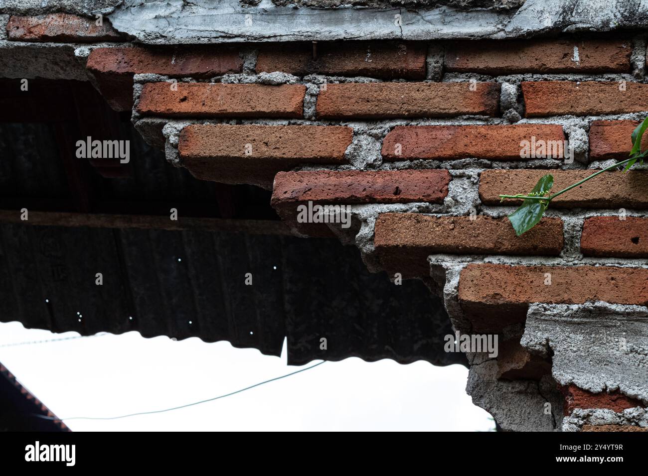 The texture of the old brick wall is weather-beaten Stock Photo - Alamy