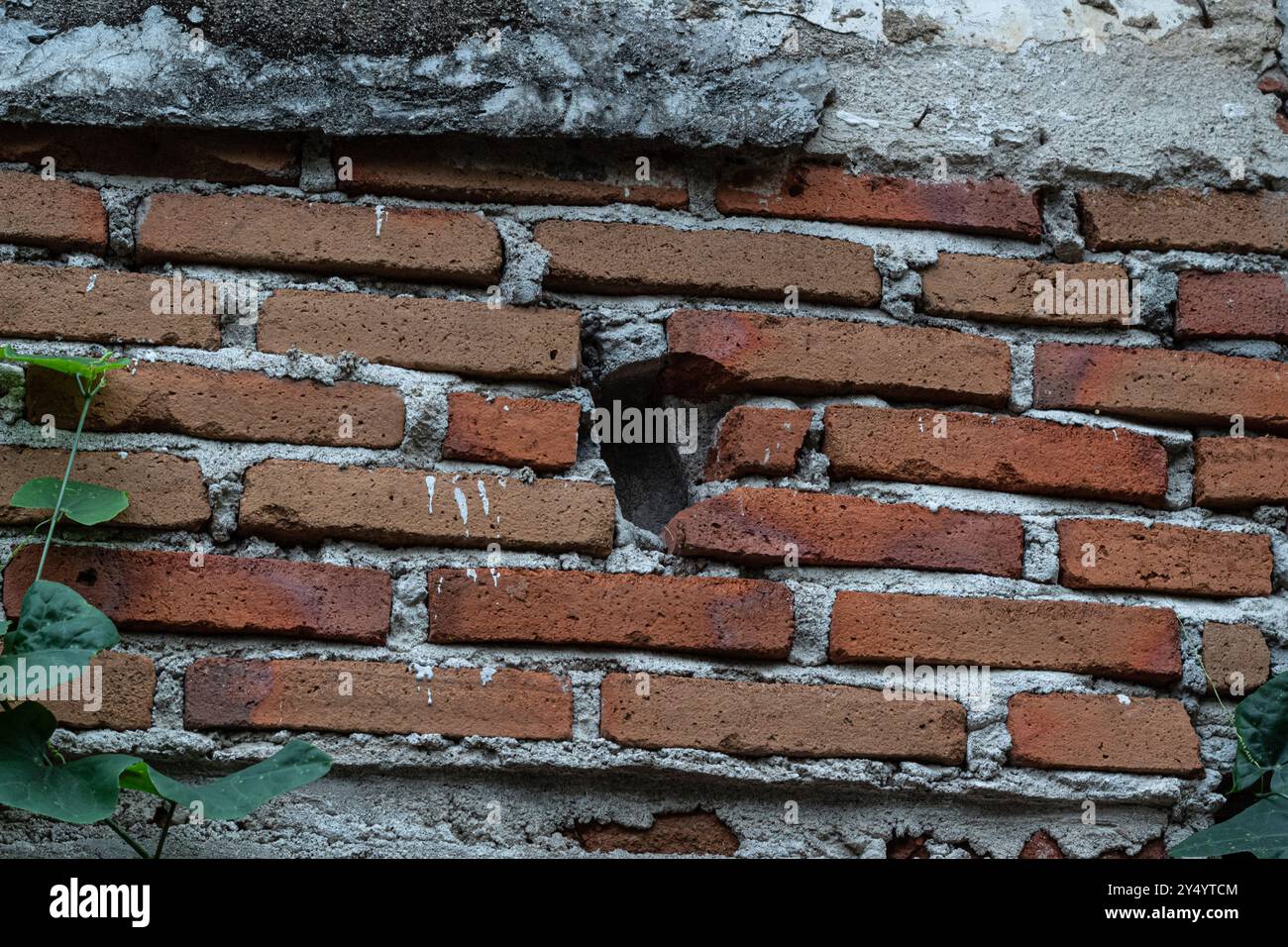The texture of the old brick wall is weather-beaten Stock Photo - Alamy