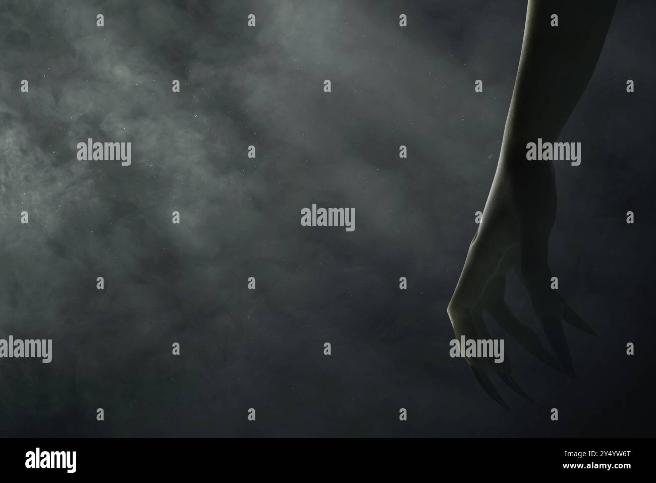 Witches hand with long nail claw. The color is green. Evil, zombie, or ...